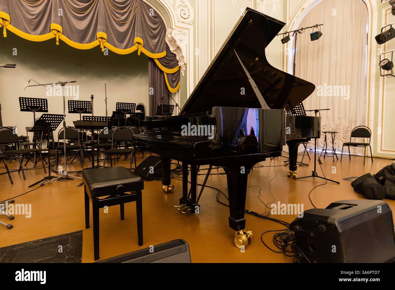 Piano at concert hall stage Stock Photo - Alamy