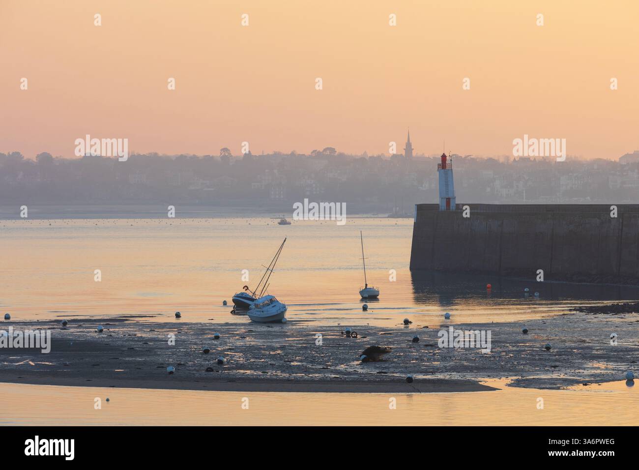 Small boats at the entrance to the port (Moles des Noire light beacon ...