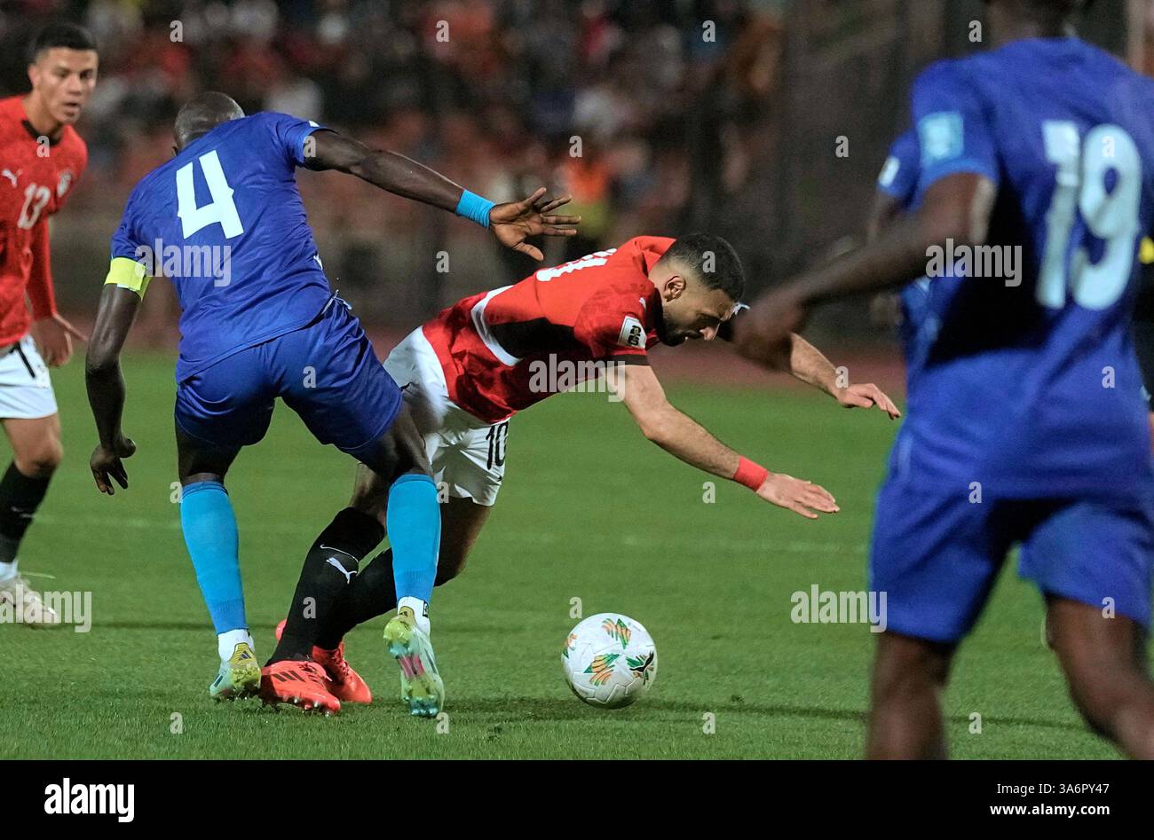Egypt's Mohamed Salah falls during a challenge for the ball with Sierra Leone's players at a ...