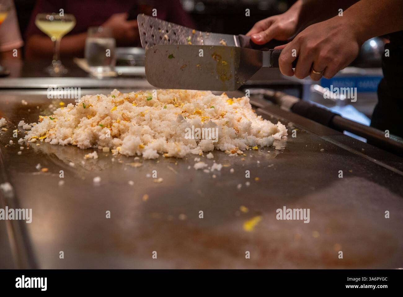 Making Japanese Fried Rice on a hibachi grill Stock Photo - Alamy