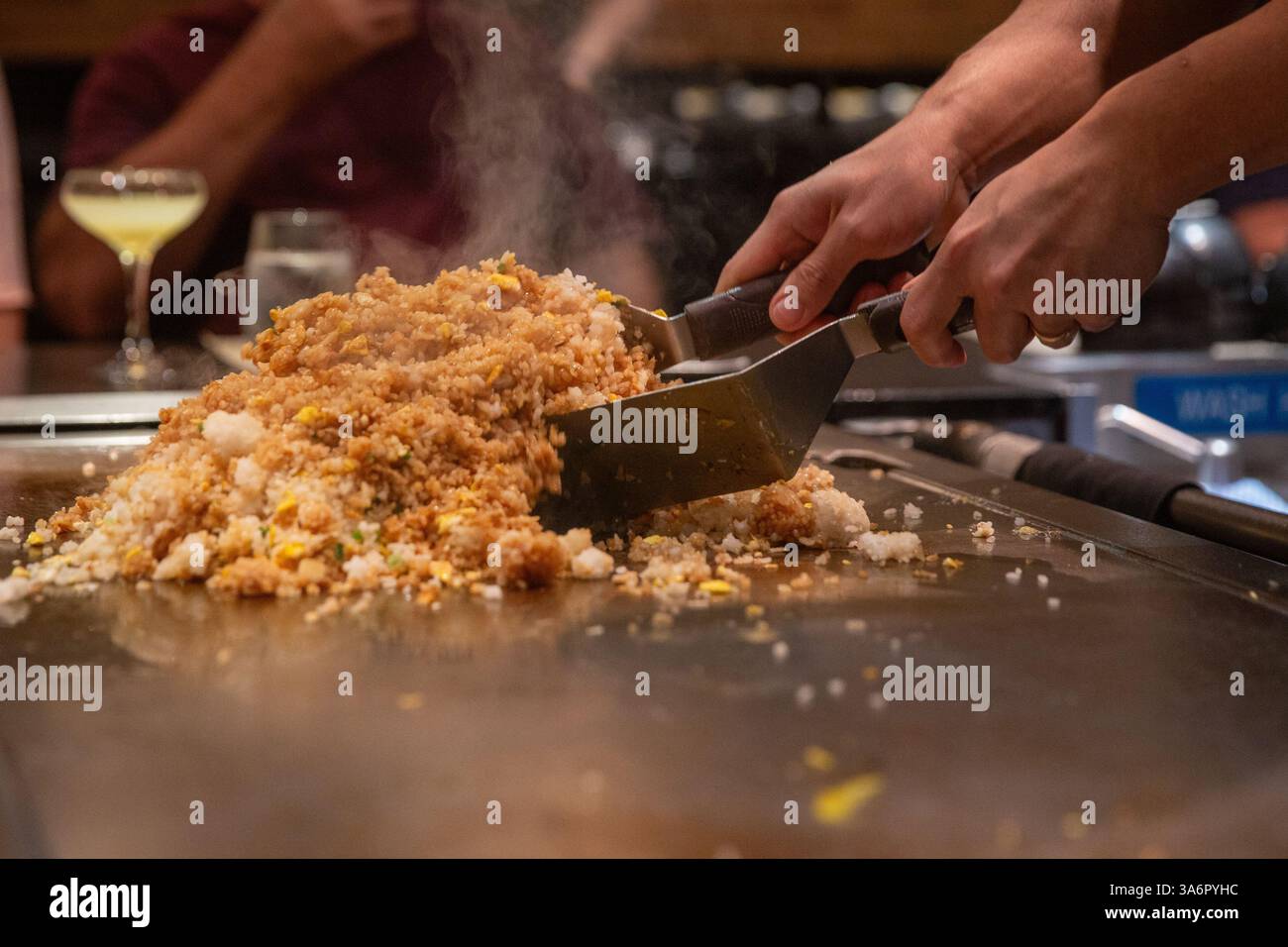Making Japanese Fried Rice on a hibachi grill Stock Photo - Alamy