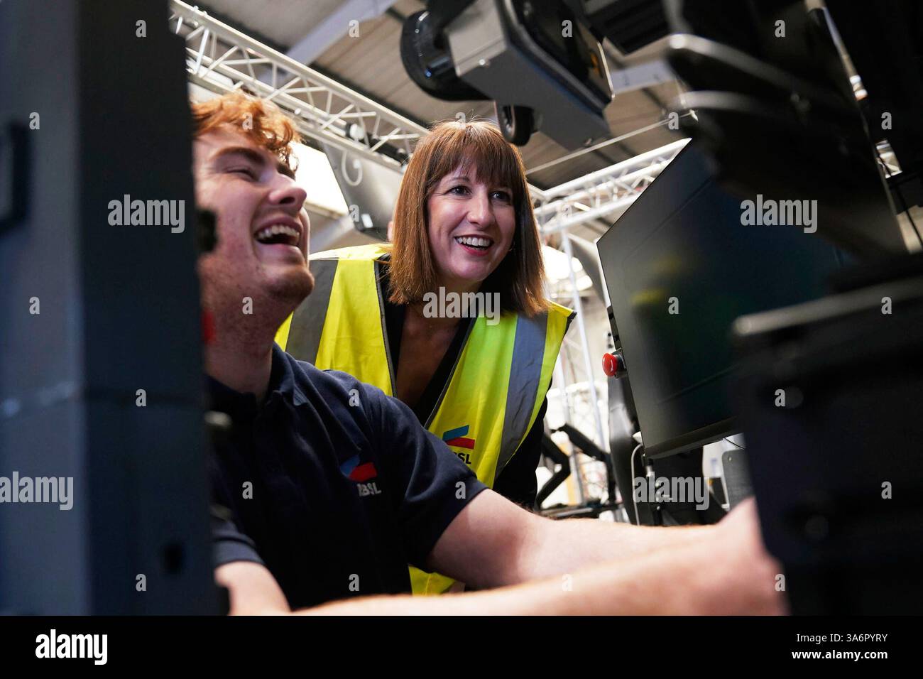 Britain's Chancellor of the Exchequer Rachel Reeves is shown a ...