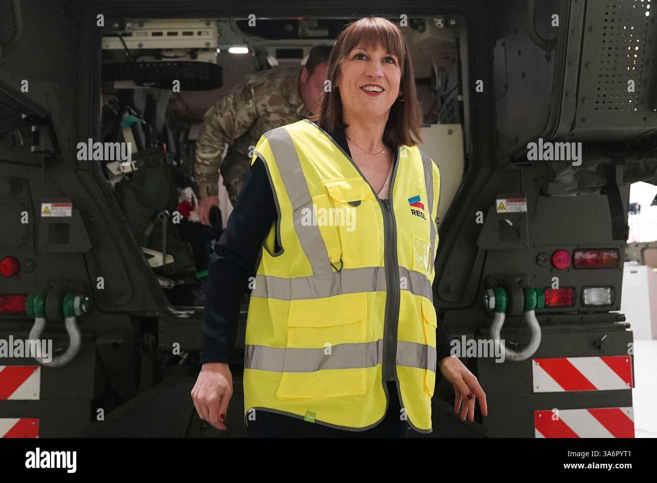 Britain's Chancellor of the Exchequer Rachel Reeves is shown a military ...