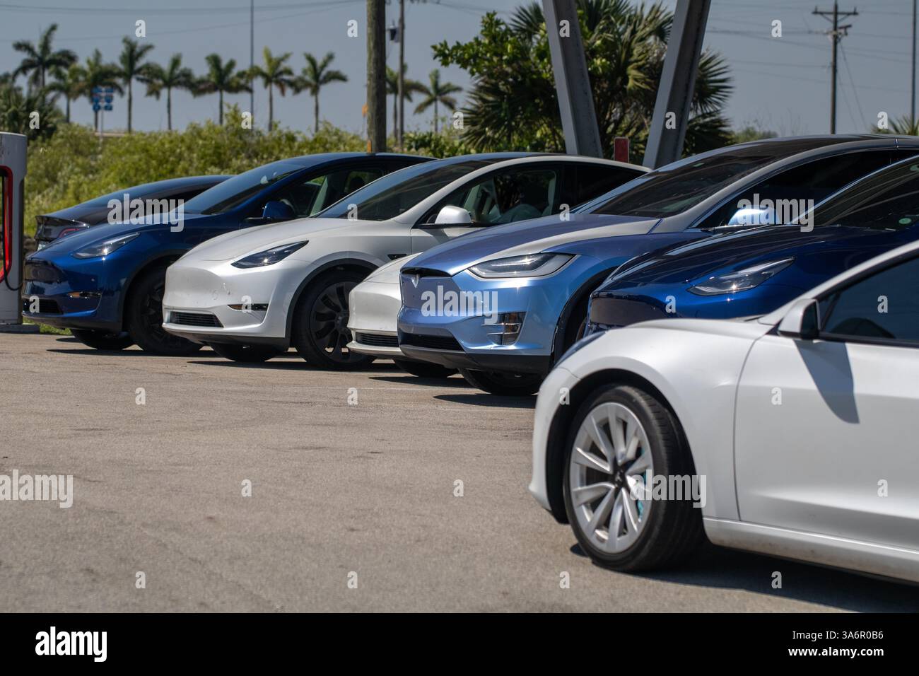 Electric Cars Charging at a rest stop Stock Photo - Alamy