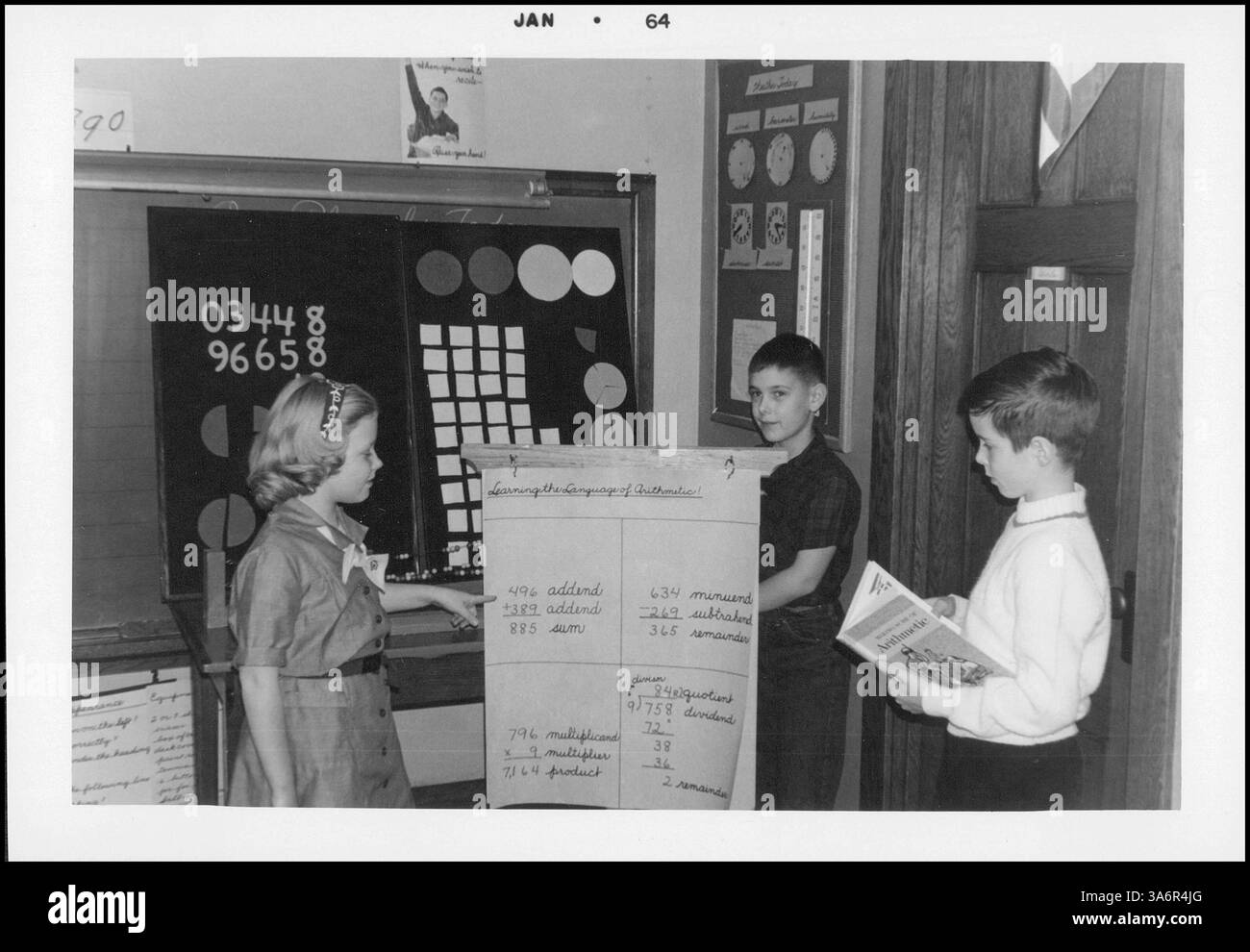 This photo, from the 1963 Annual Report, shows students learning the basics of arithmetic ...