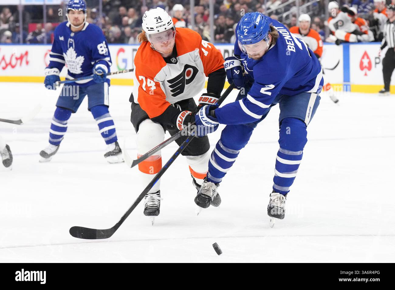 Toronto Maple Leafs' Simon Benoit (2) battles for the puck with ...