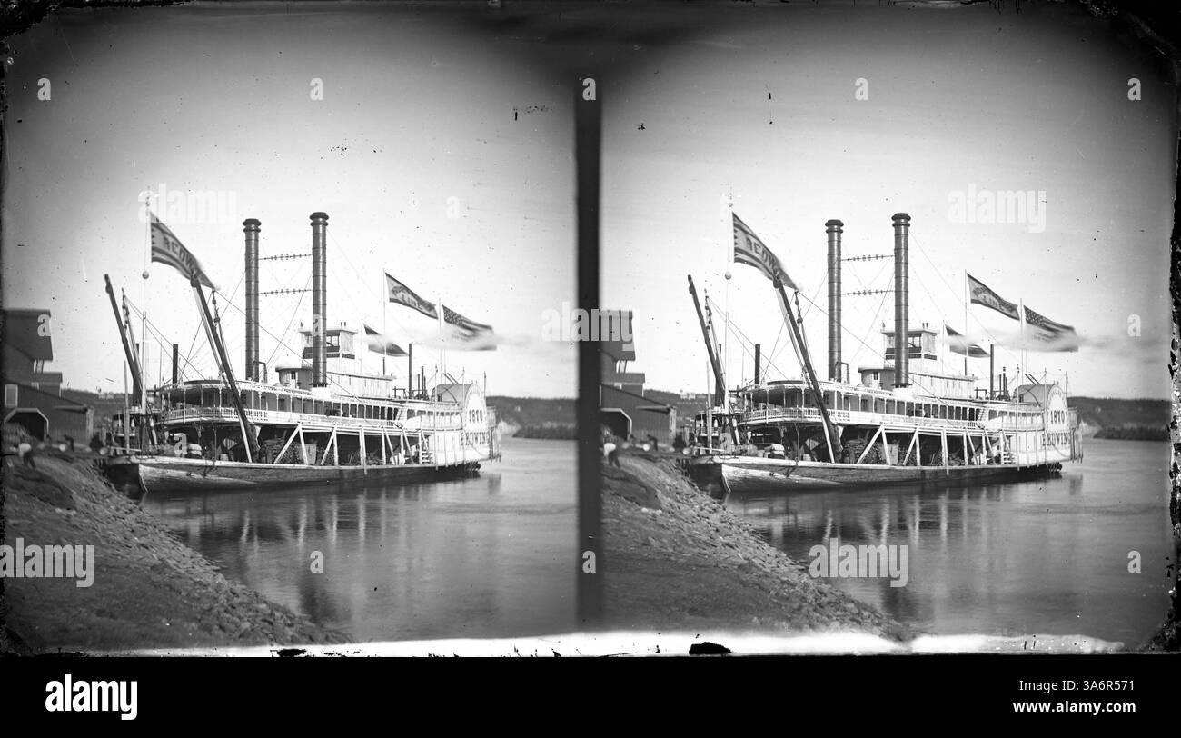 The steamboat 'Red Wing' is seen docked at St. Paul with longshoremen ...