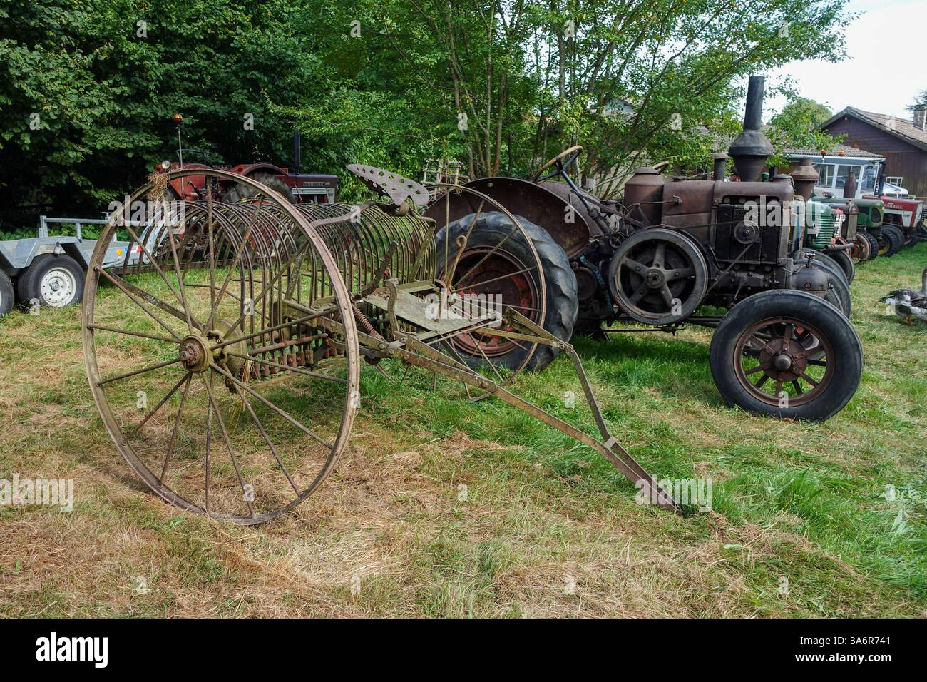 Rusty Vintage Hay Rake and Tractor Stock Photo - Alamy