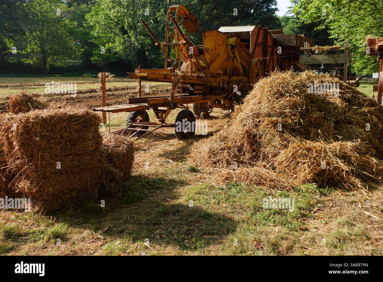 Vintage Threshing Machine with Hay Bales Stock Photo - Alamy