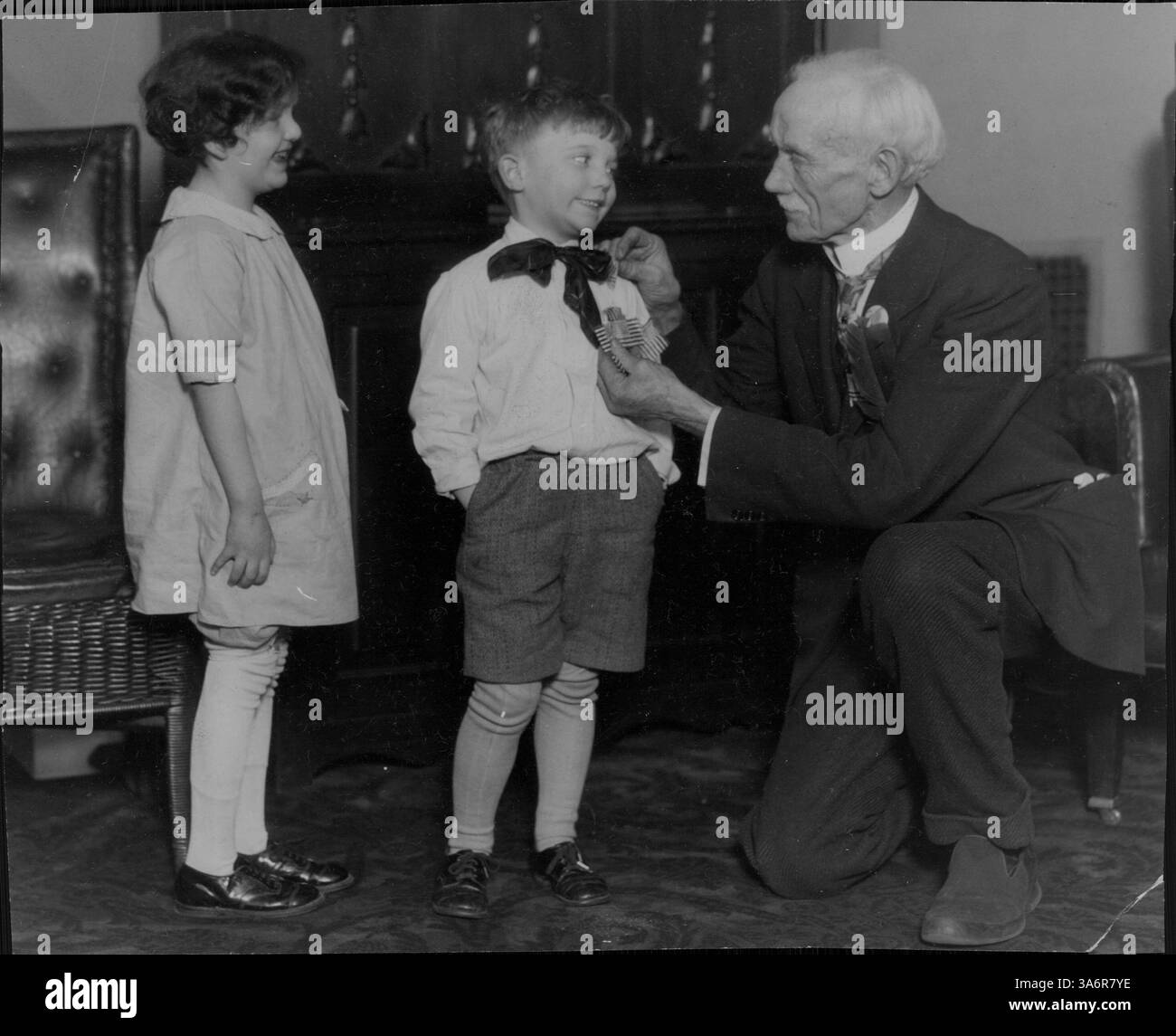 At the Elk's Fete, children received tiny American flags from Lawler, a ...