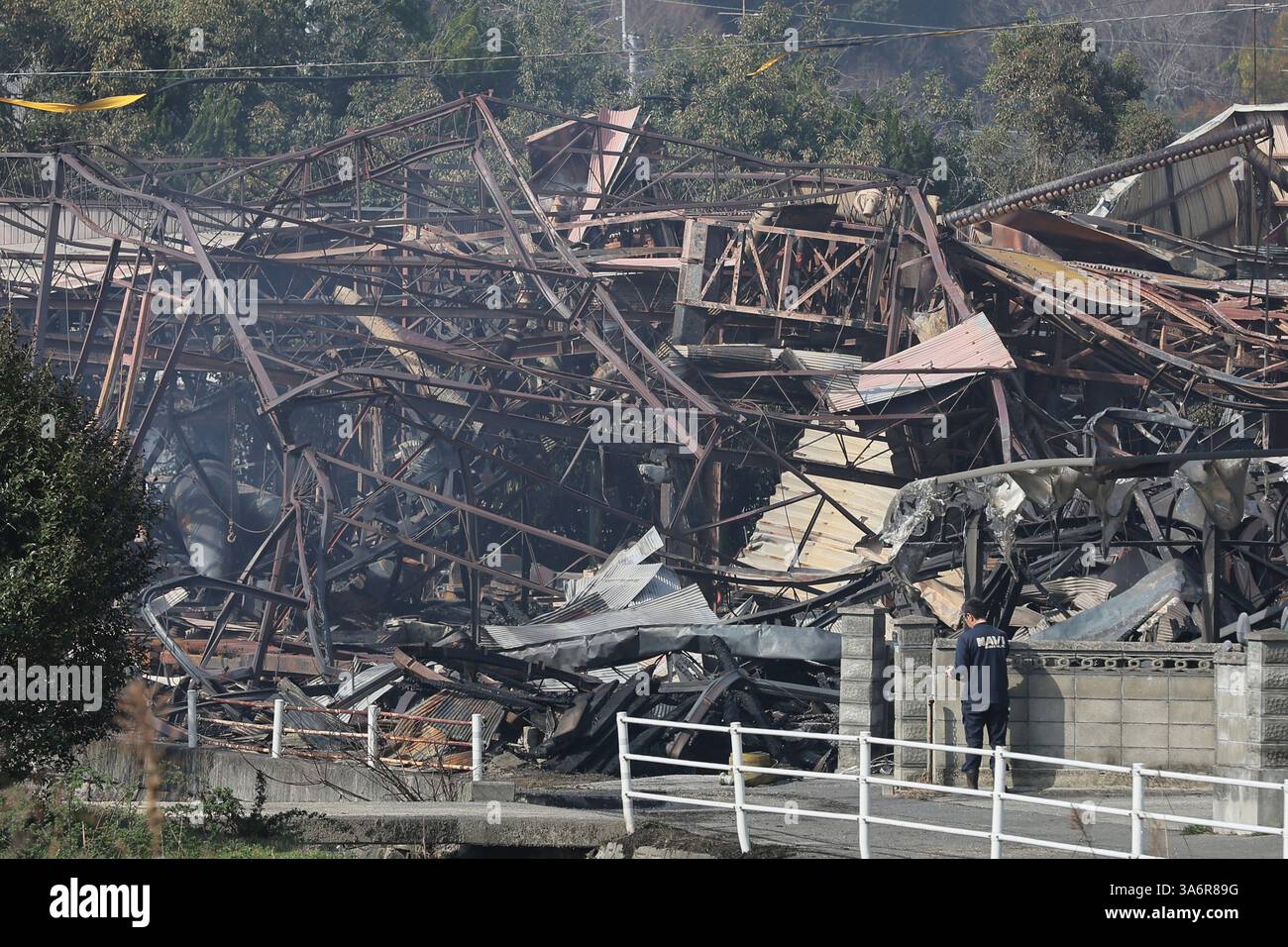 A photo shows burnt houses due to forest fire in Imabari City, Ehime ...