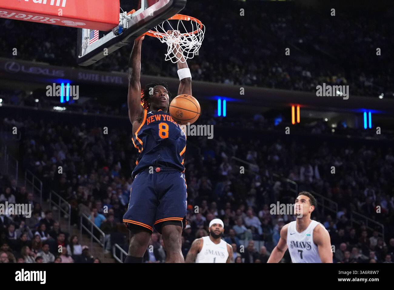 New York Knicks' OG Anunoby (8) dunks the ball in front of Dallas ...