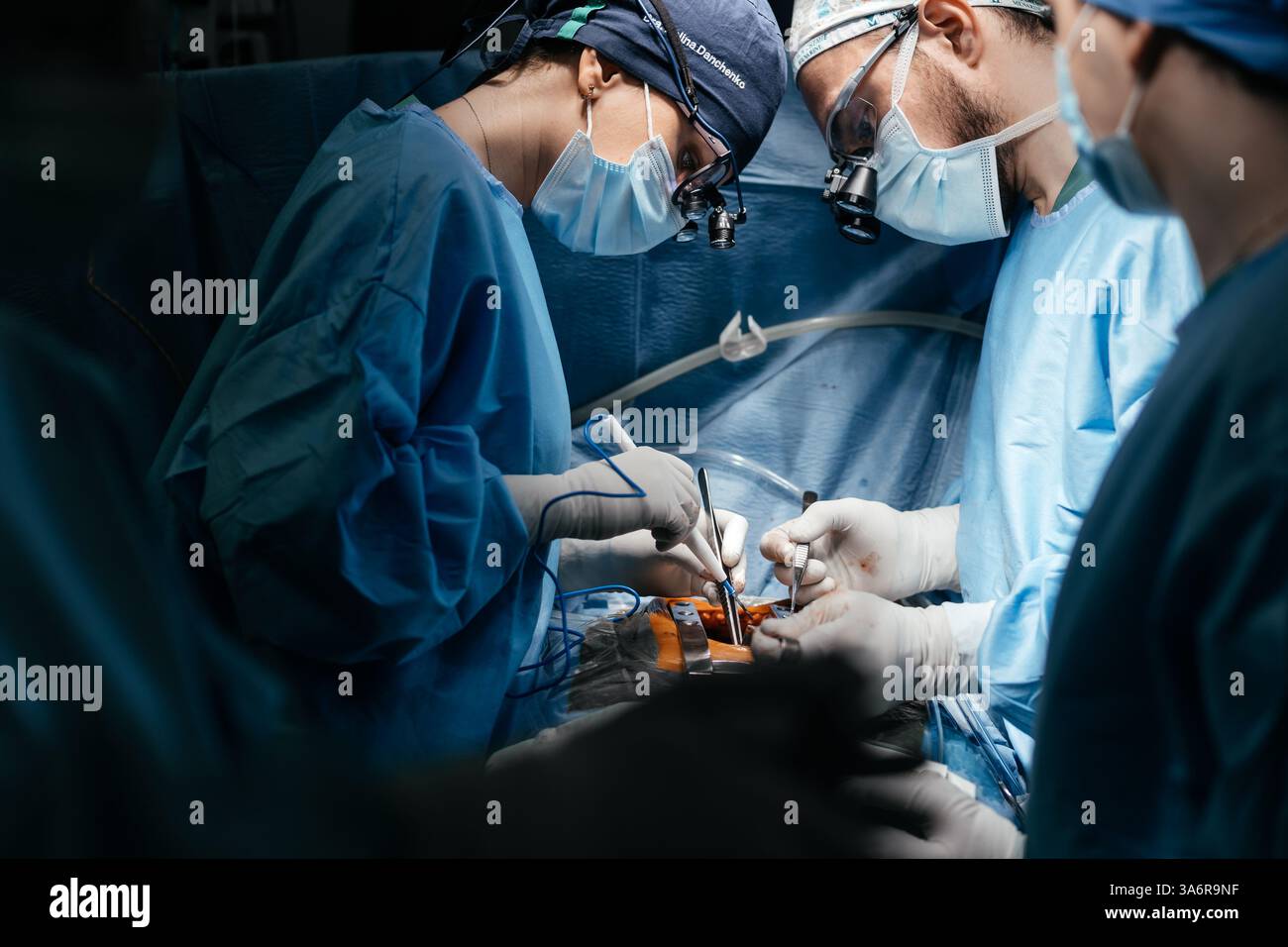 Surgery team operating in modern hospital. Medical workers teamwork ...