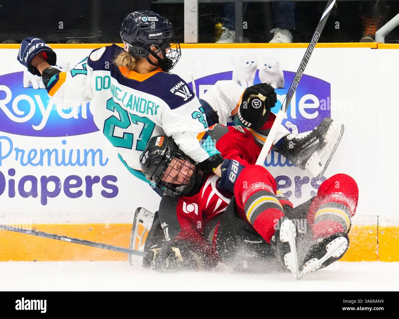 New York Sirens' Jade Downie-Landry (27) falls to the ice with Ottawa ...
