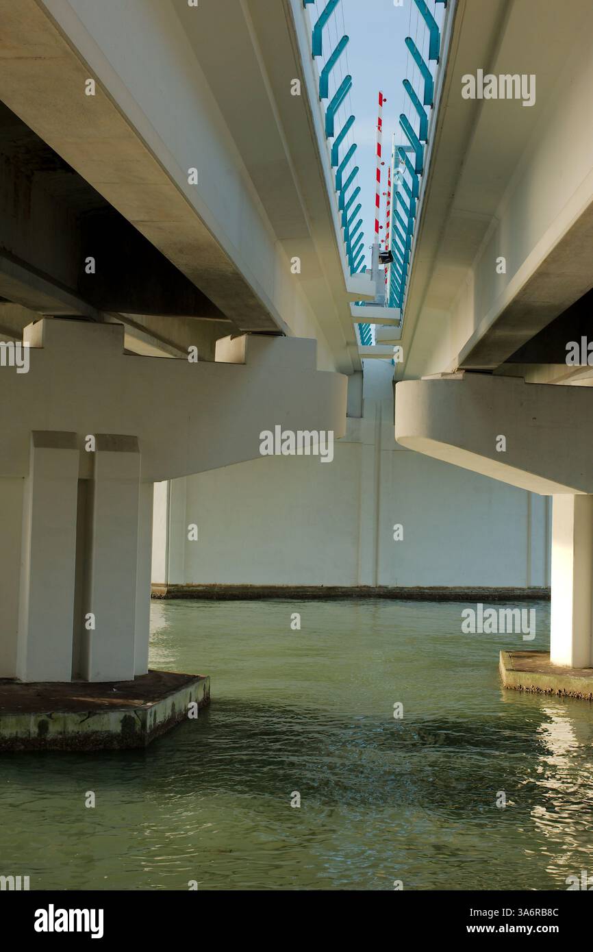 Up through an opening in the bridge's support structure and the water ...