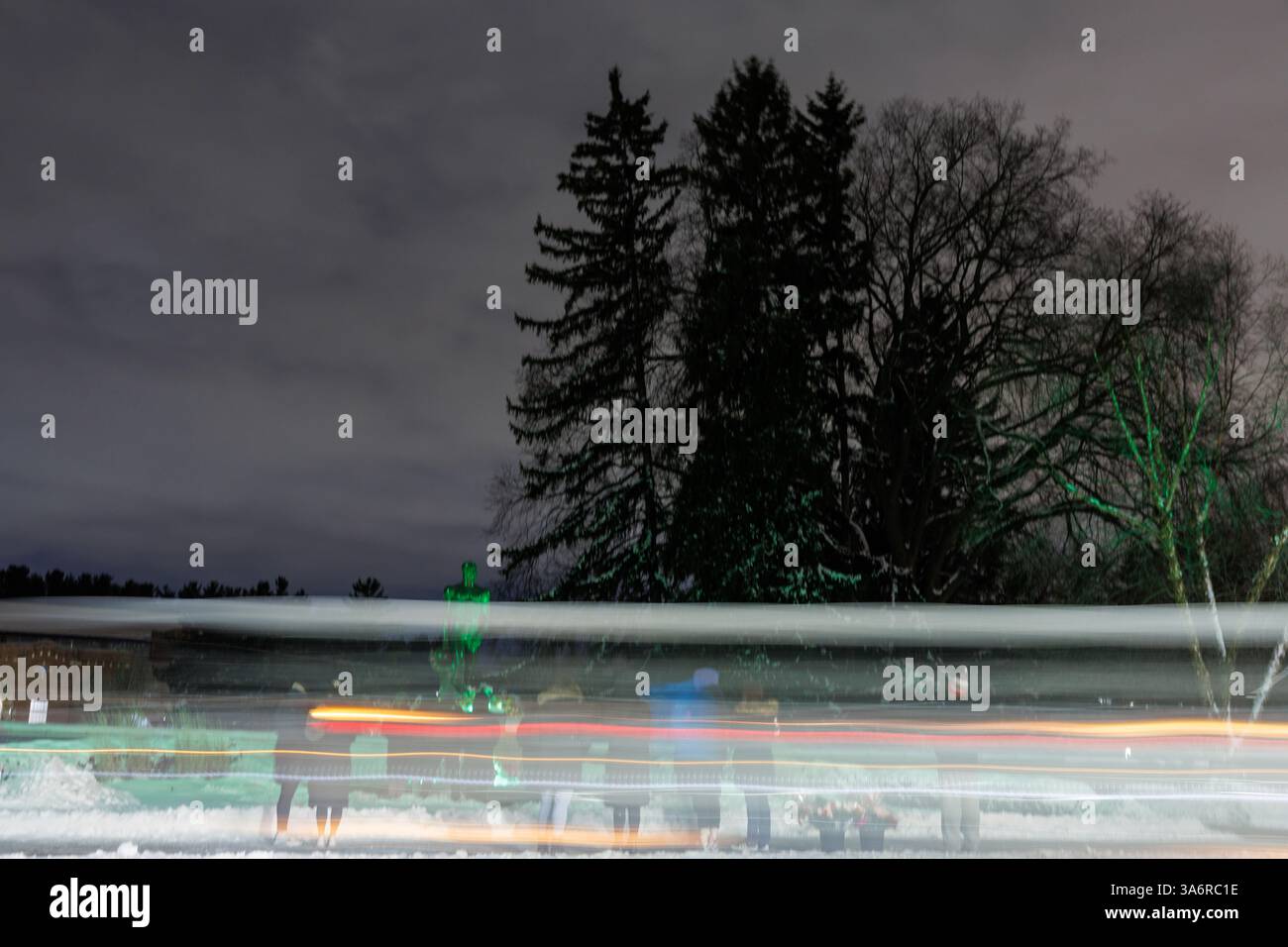 Community members leave flowers and luminaries at the Spartan Statue on ...