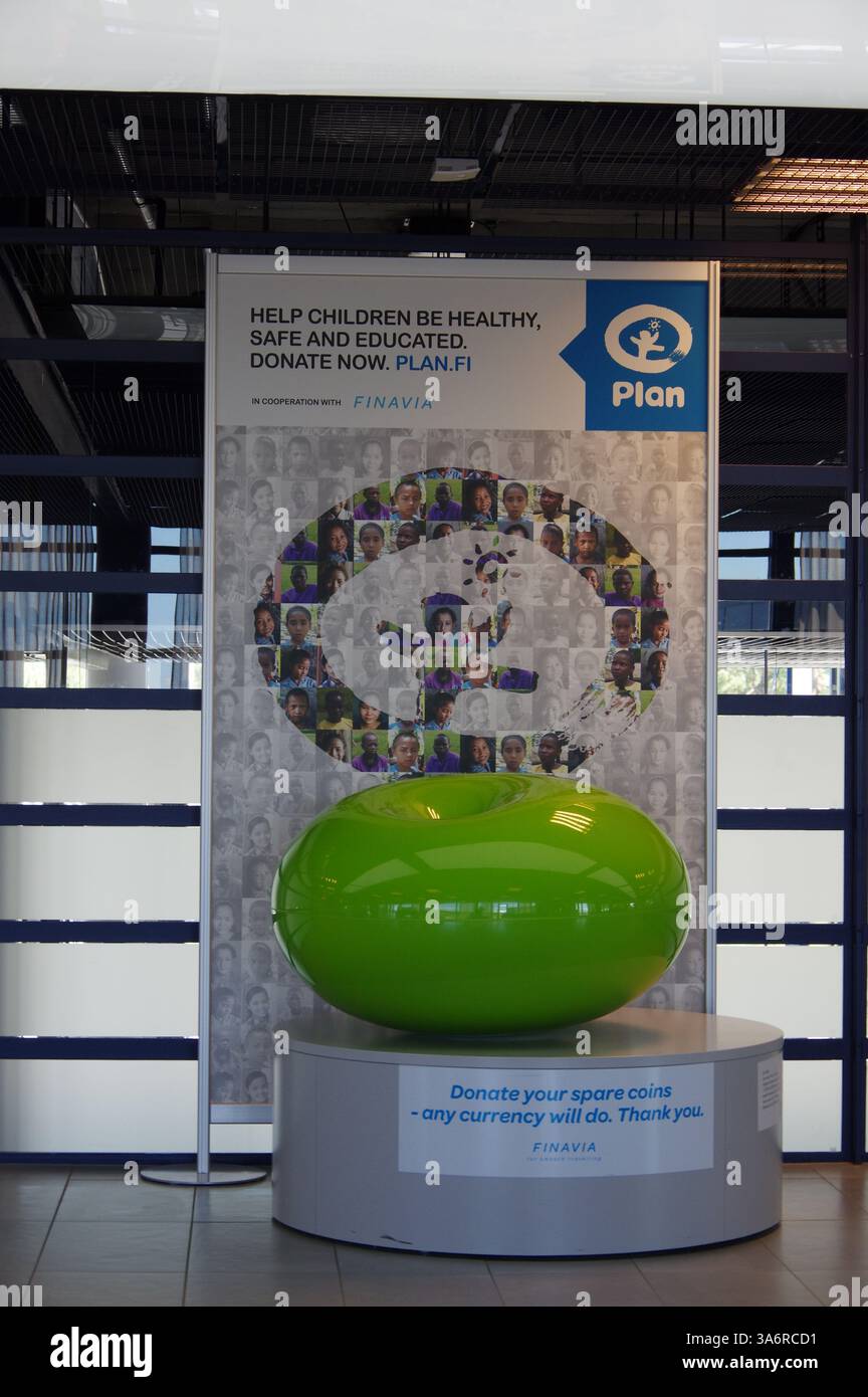 19 Jul 2016 - Plan Fi ngo donation box at Oulu Airport Stock Photo - Alamy