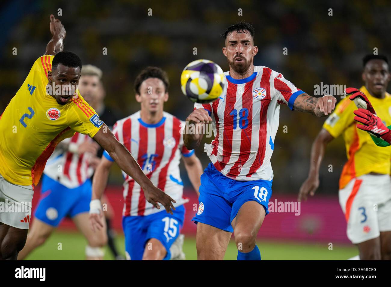 Colombia's Carlos Cuesta, left, and Paraguay's Gabriel Avalos eye the ...