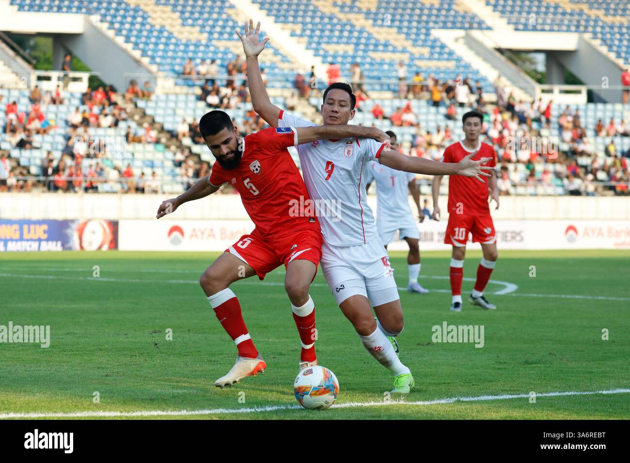 Yangon, Myanmar. 25th Mar, 2025. Suleman Zurmati (L) of Afghanistan ...