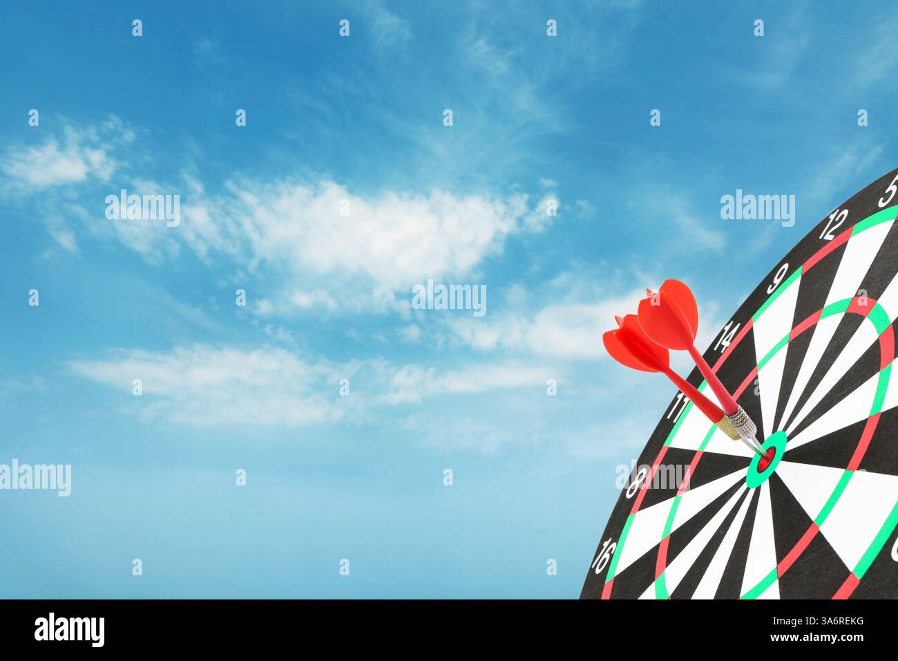 Dart board with arrows against blue sky. Concepts of targeting ...