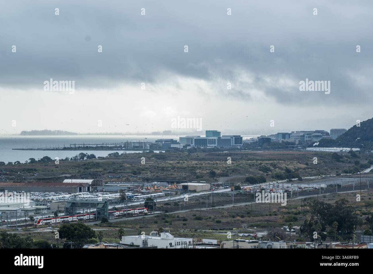 Overcast weather reveals a view of buildings and harbor along the ...