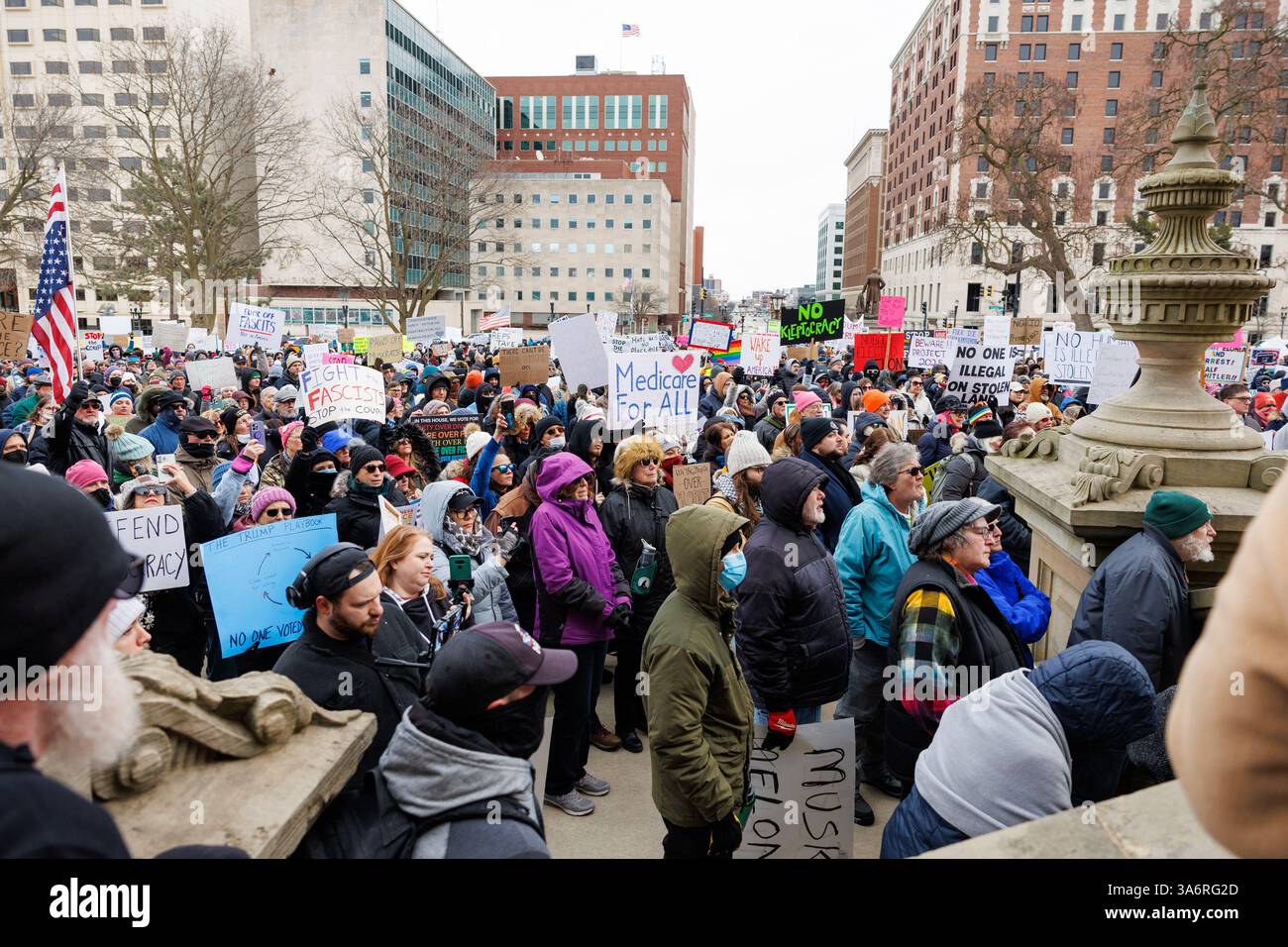 Hundreds of people gather on the steps of the Michigan State Capitol in ...