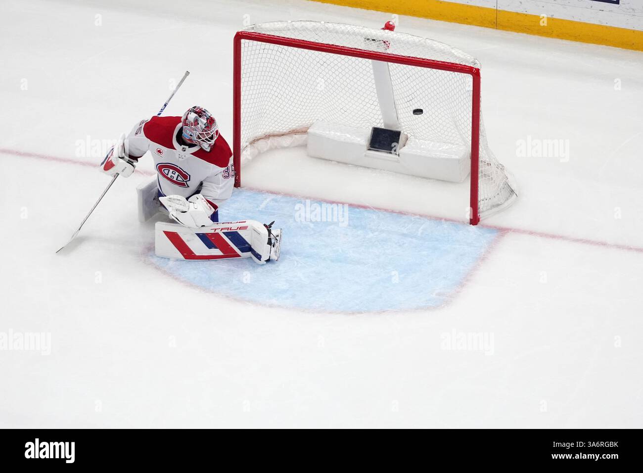 Montreal Canadiens goaltender Sam Montembeault watches as a shot by St ...
