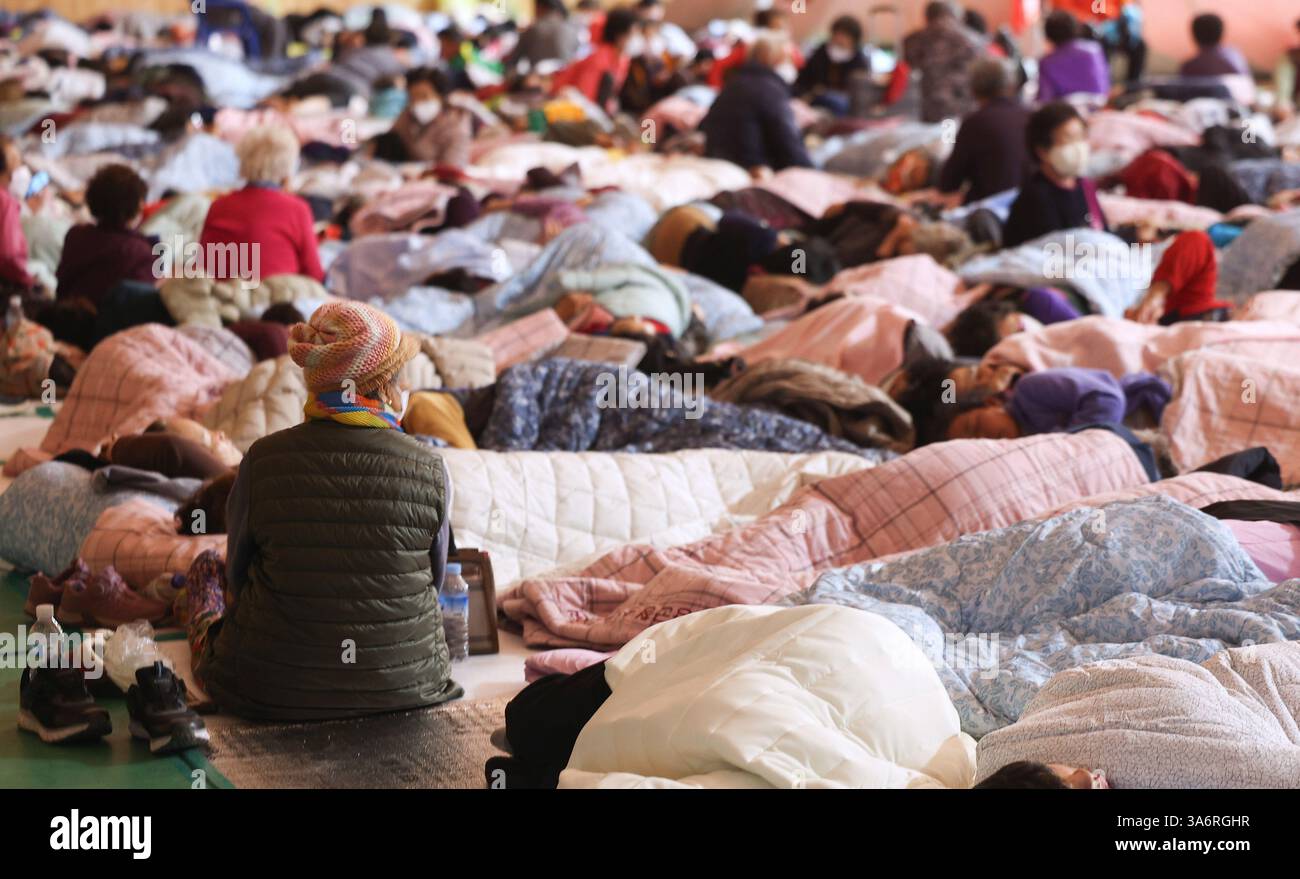 Escaped villagers from wildfires take rest at a shelter in Yeongyang, South Korea, Wednesday ...