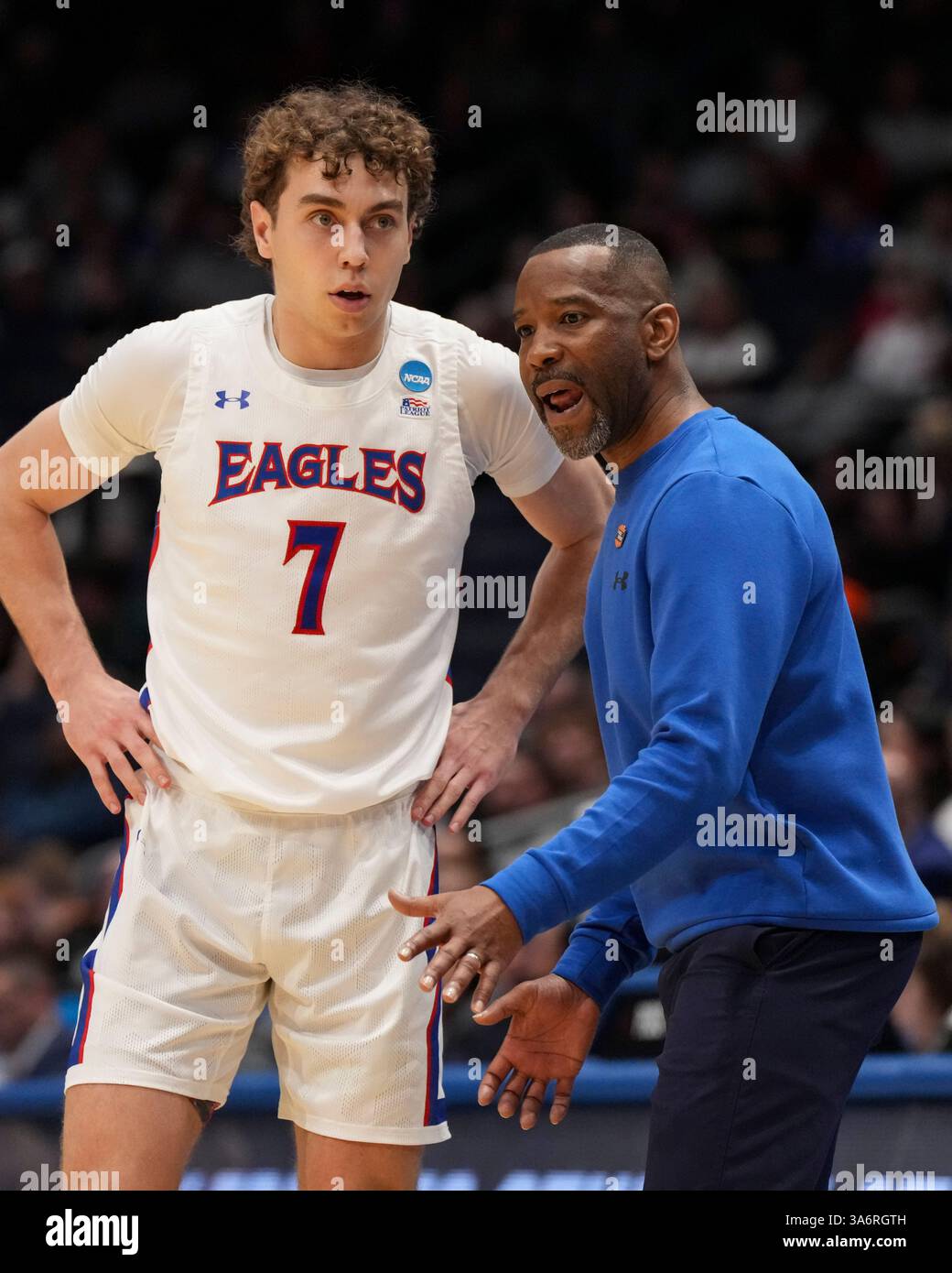 American University guard Wyatt Nausadis (7) speaks with head coach ...