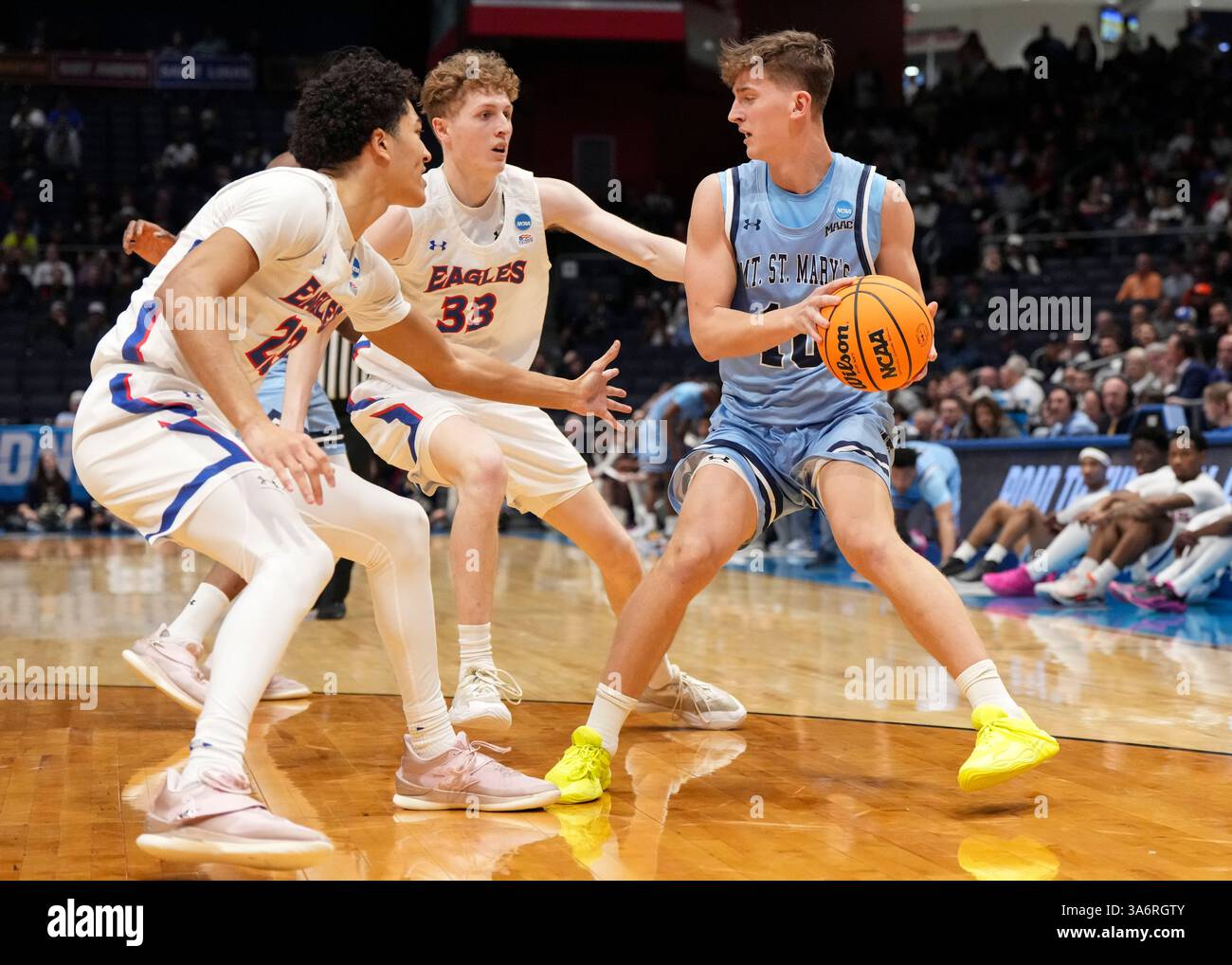 Mount St. Mary's guard Patrick Haigh (10) is guarded by American ...