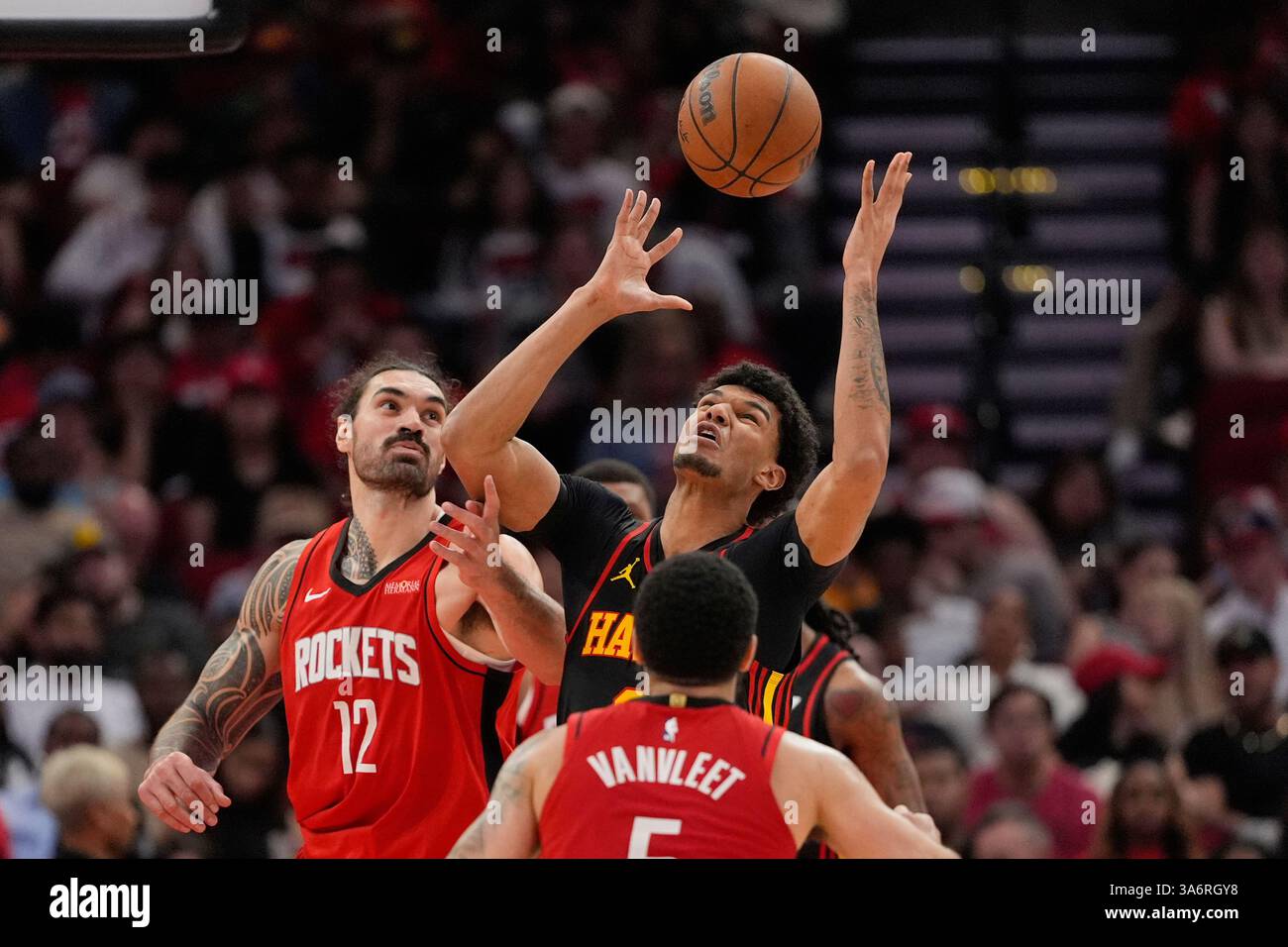 Atlanta Hawks' Dominick Barlow, right, reaches for a loose ball in ...