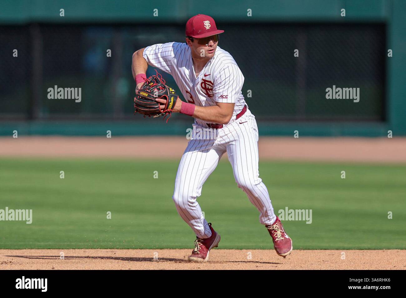 Florida State infielder Drew Faurot (3) warms up before an NCAA ...