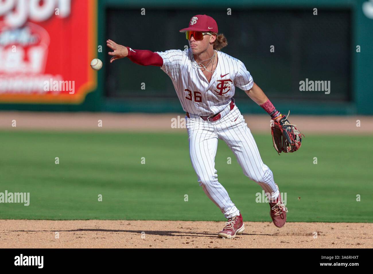 Florida State infielder Jace Estes (36) warms up before an NCAA ...