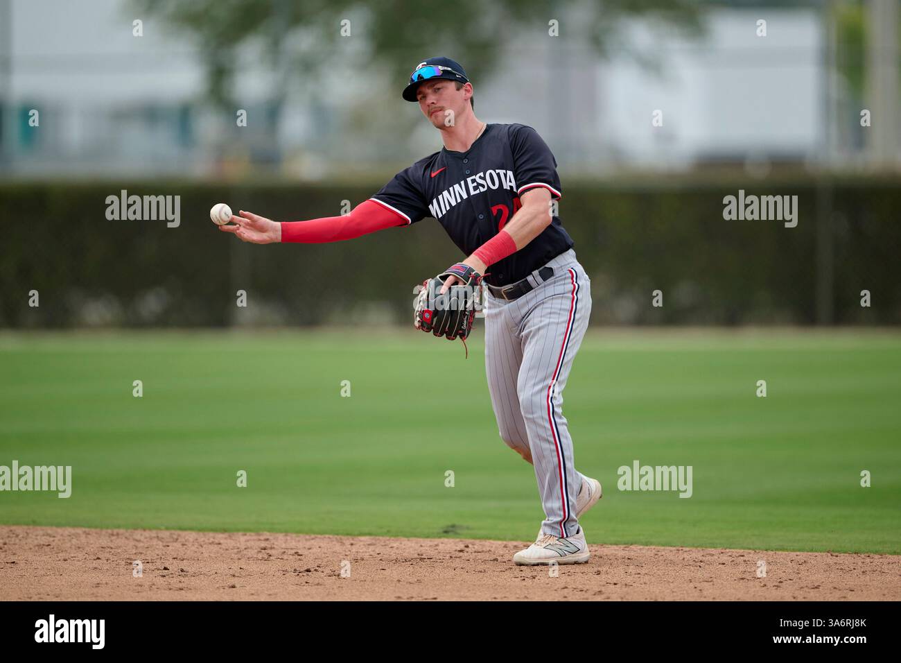 Minnesota Twins second baseman Jake Rucker (24) throws to first base ...
