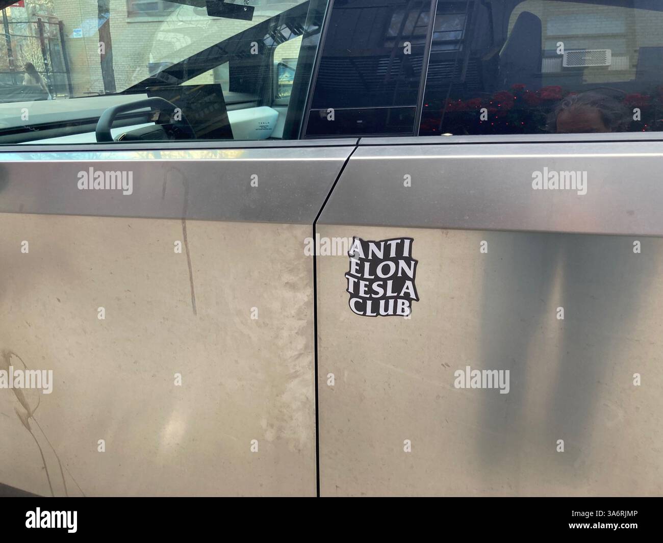 March 25, 2025, New York City, New York, USA: Sticker affixed to Telsa ...