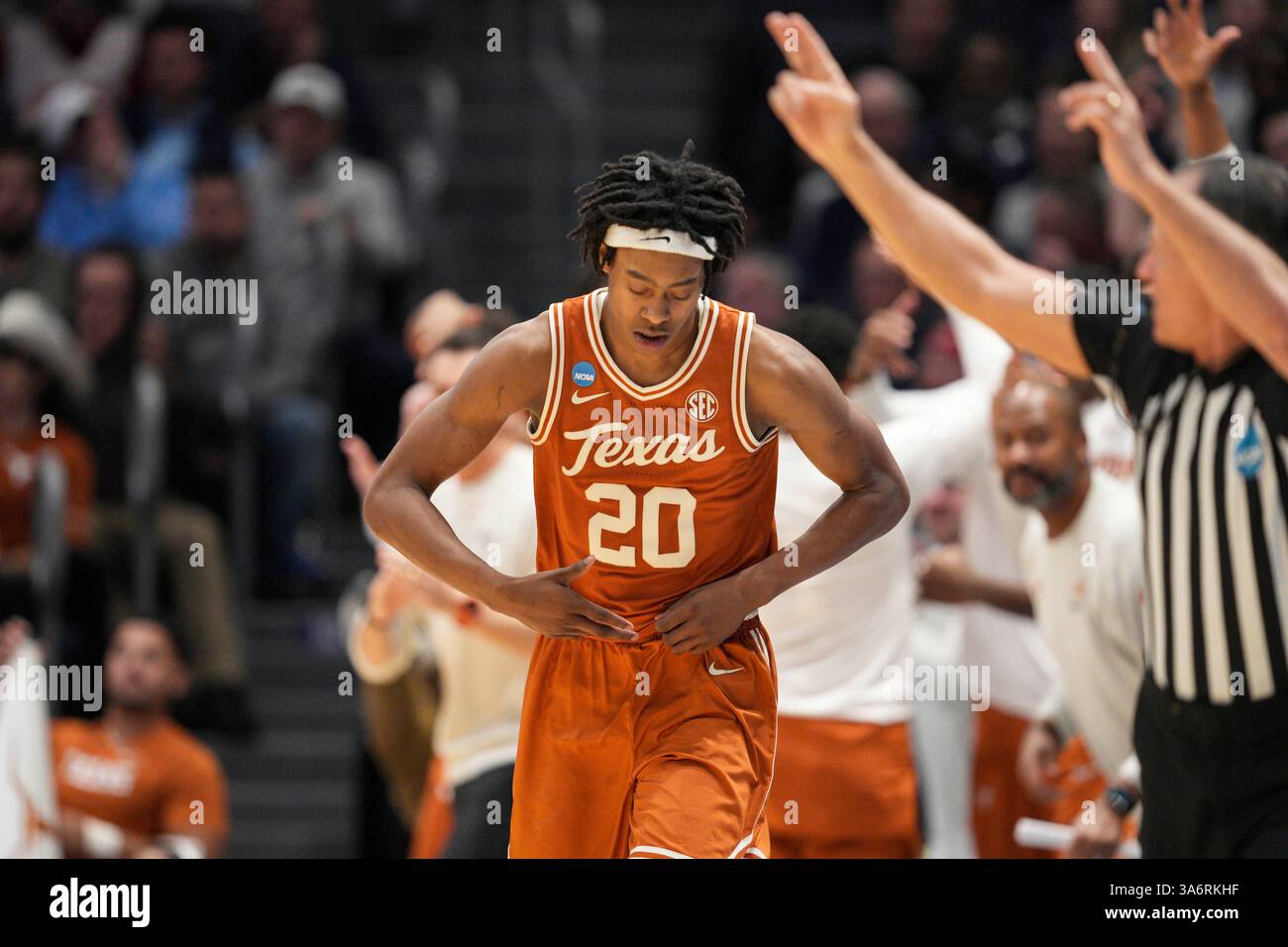 Texas guard Tre Johnson (20) reacts after scoring during a First Four ...