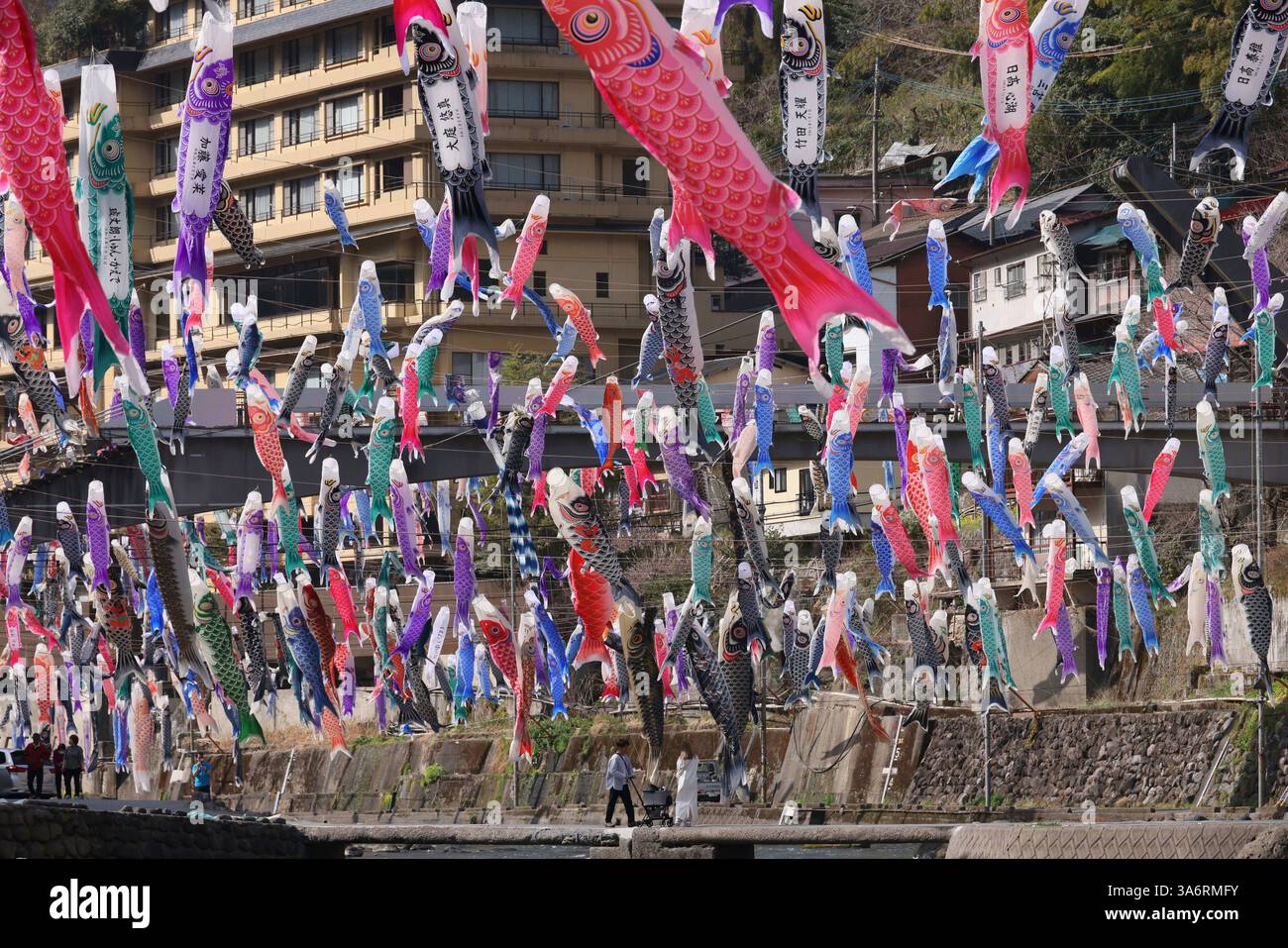 Approximately 3,000 colorful carp streamers sway in the wind over the ...