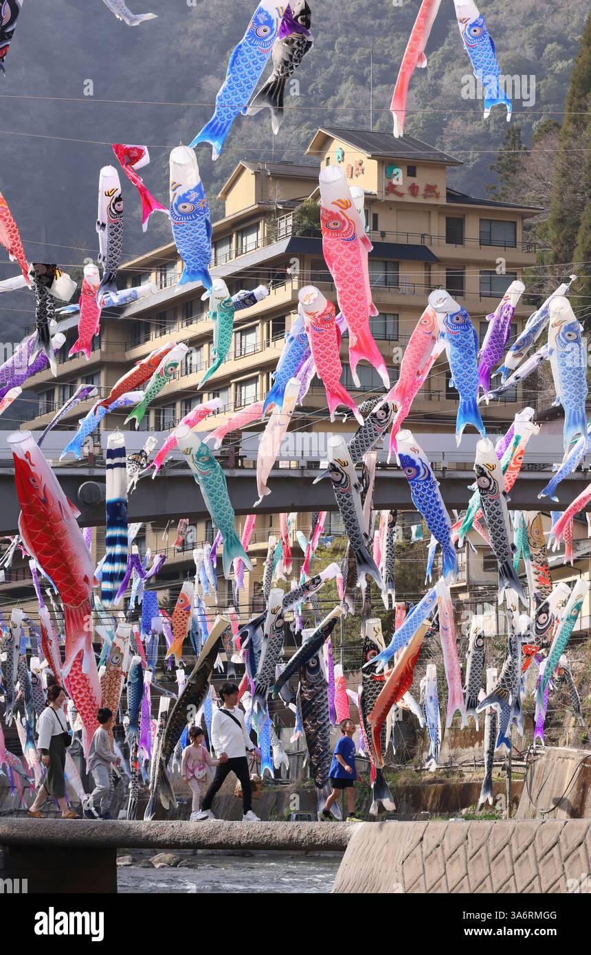 Approximately 3,000 colorful carp streamers sway in the wind over the ...