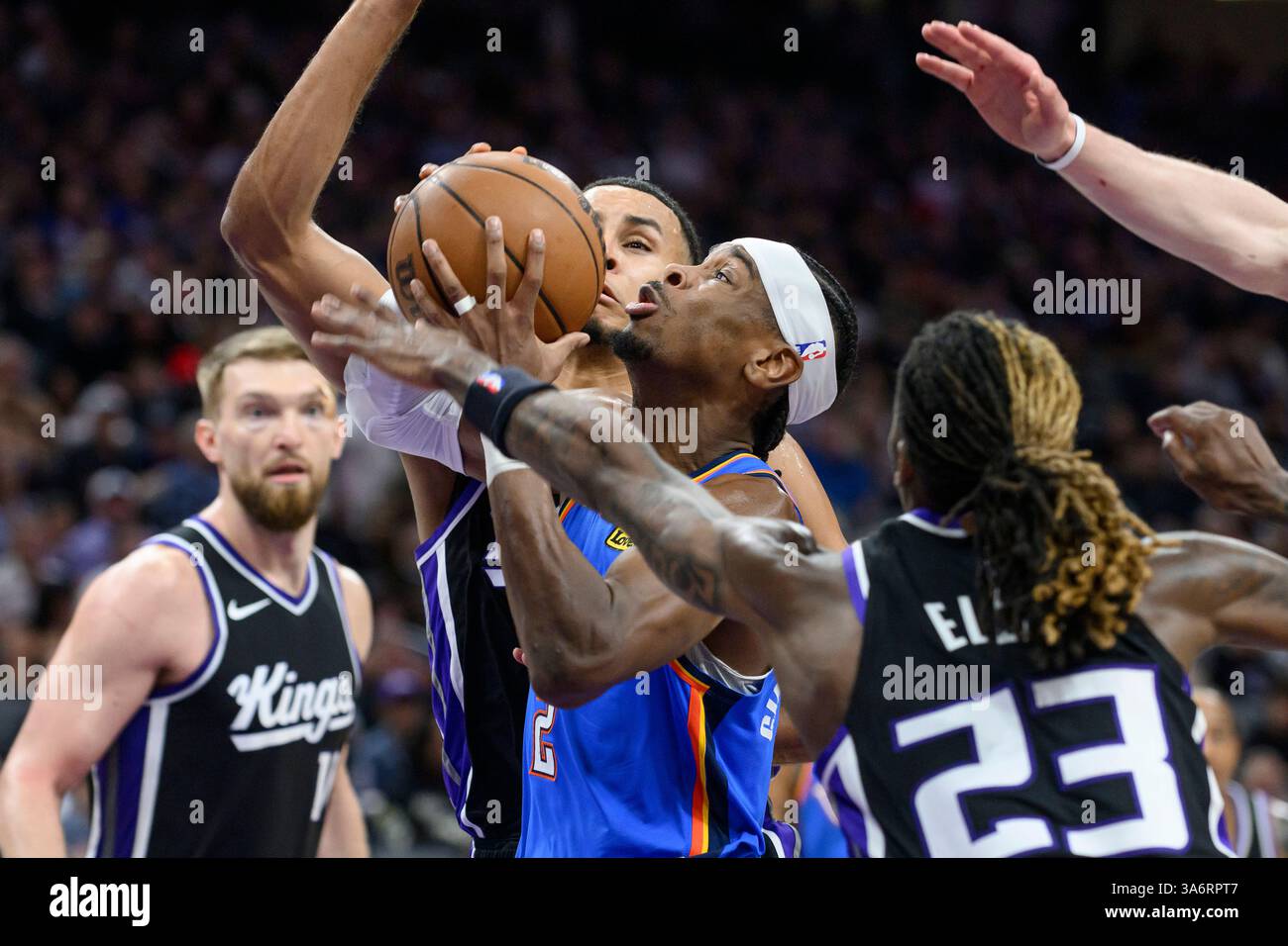 Oklahoma City Thunder guard Shai Gilgeous-Alexander, center, drives to ...