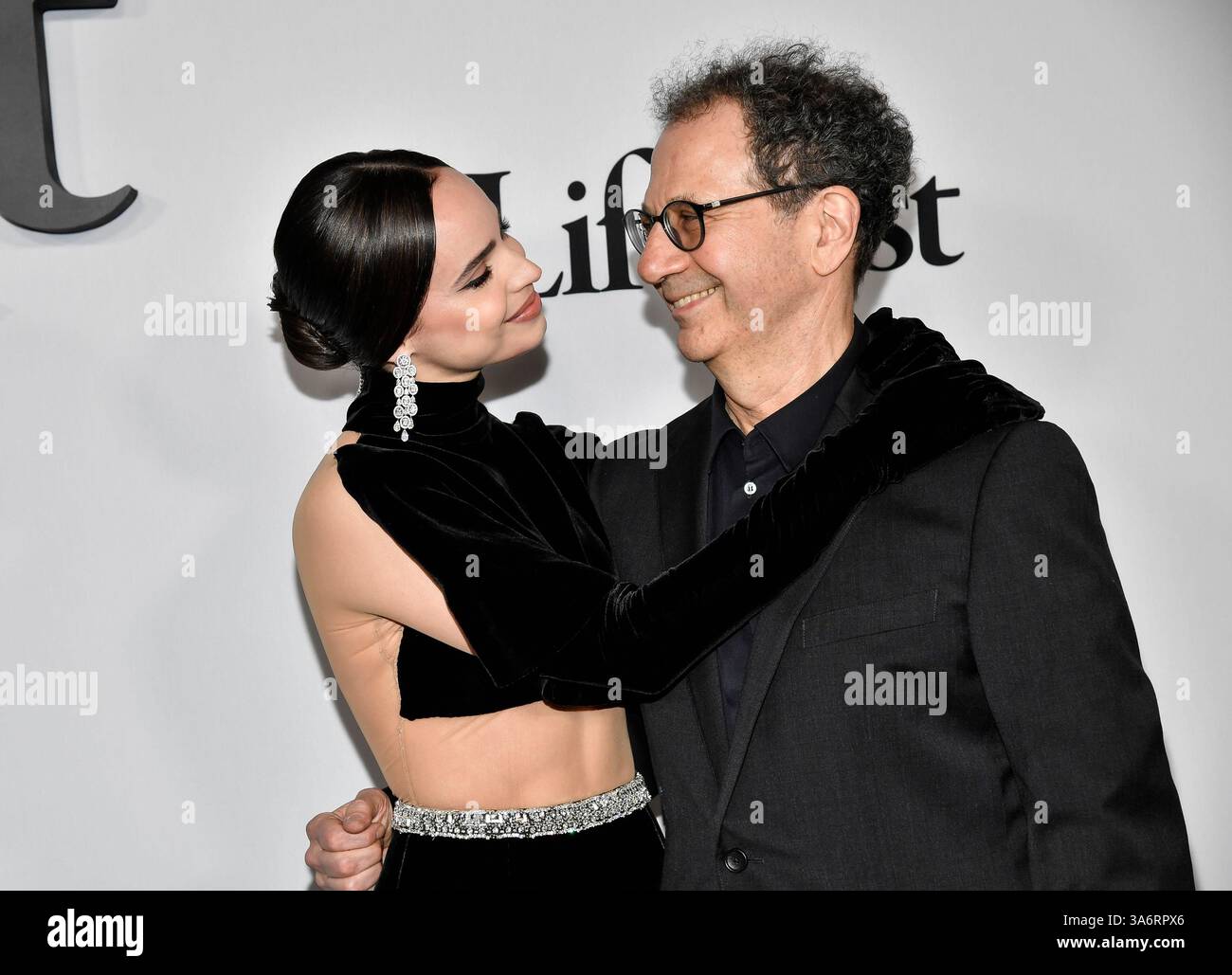 Sofia Carson, left, and Adam Brooks attend the premiere of Netflix's ...