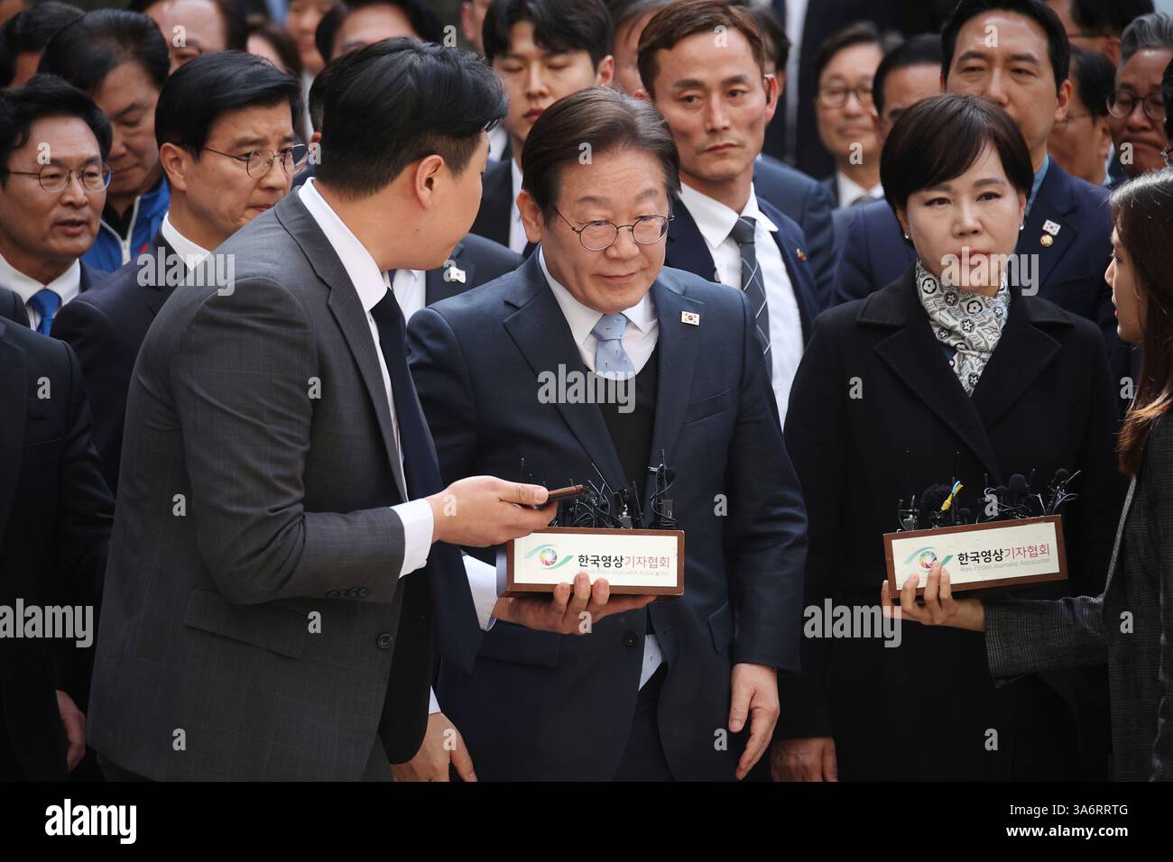 Lee Jae-myung, center, leader of South Korea's main opposition Democratic Party, arrives at a ...