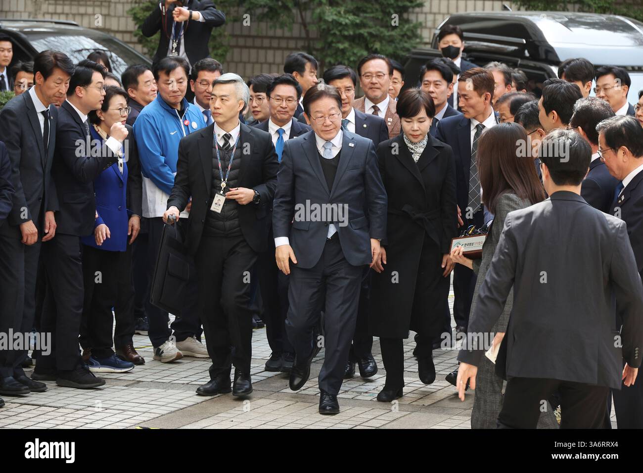 Lee Jae-myung, center, leader of South Korea's main opposition Democratic Party, arrives at a ...