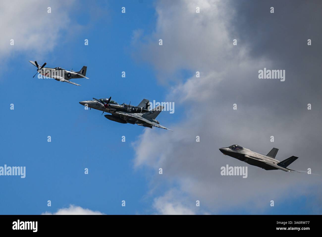 Melbourne, Australia. 25th Mar, 2025. Four different planes fly in ...