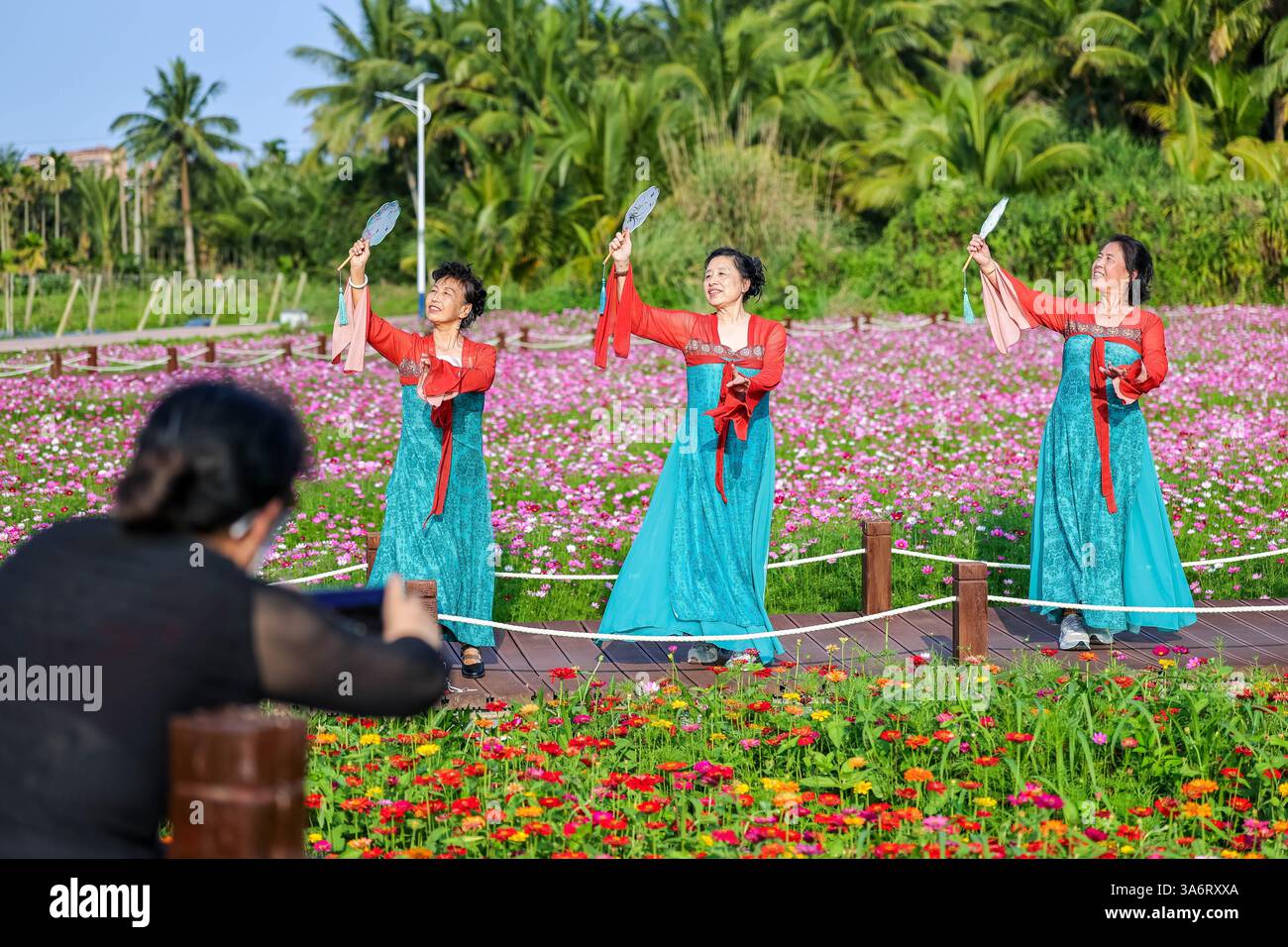 **CHINESE MAINLAND, HONG KONG, MACAU AND TAIWAN OUT** Tourists enjoy ...