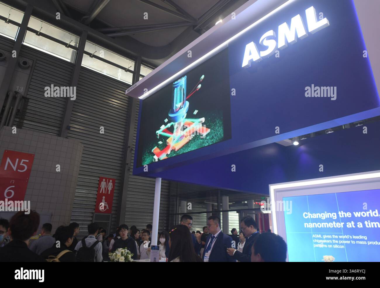 SHANGHAI, CHINA - MARCH 26, 2025 - Visitors visit ASML's lithography equipment at SEMICON China ...