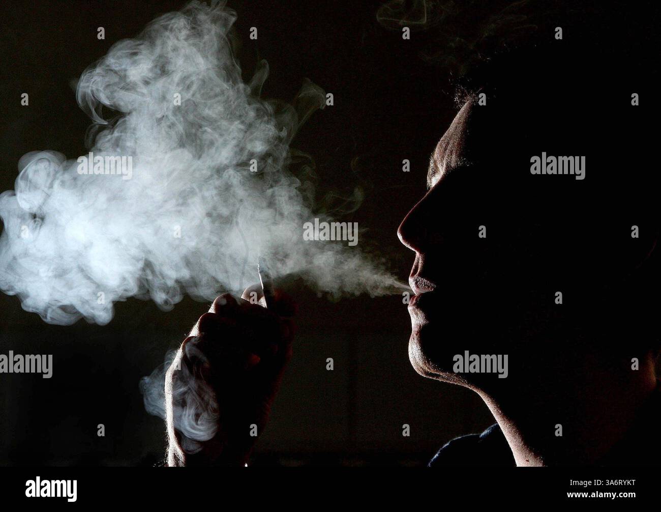 File photo dated 05/12/06 of a smoker in Dublin. Creating a smoke-free ...
