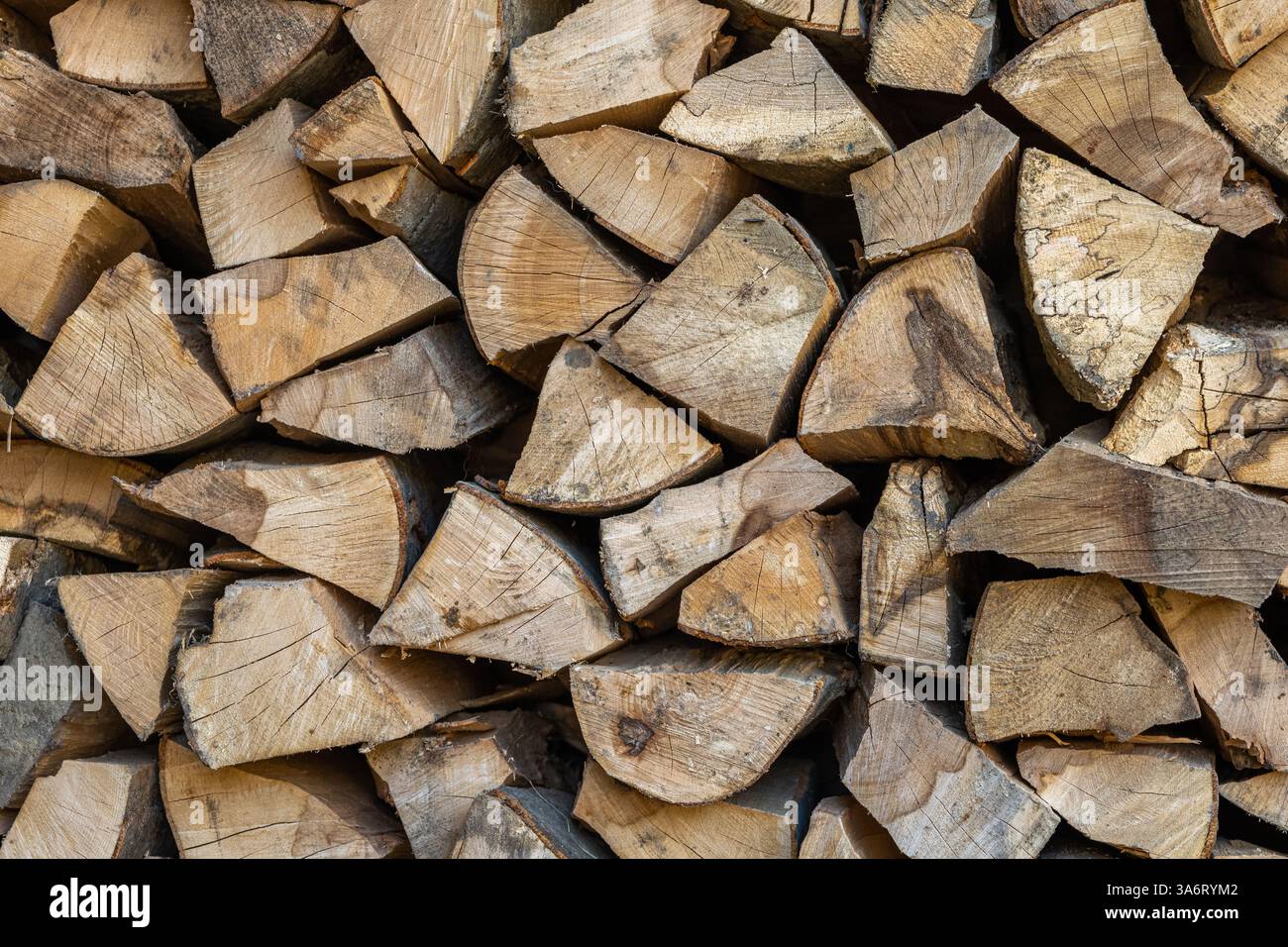 Side view of chopped firewood ready for use Stock Photo - Alamy