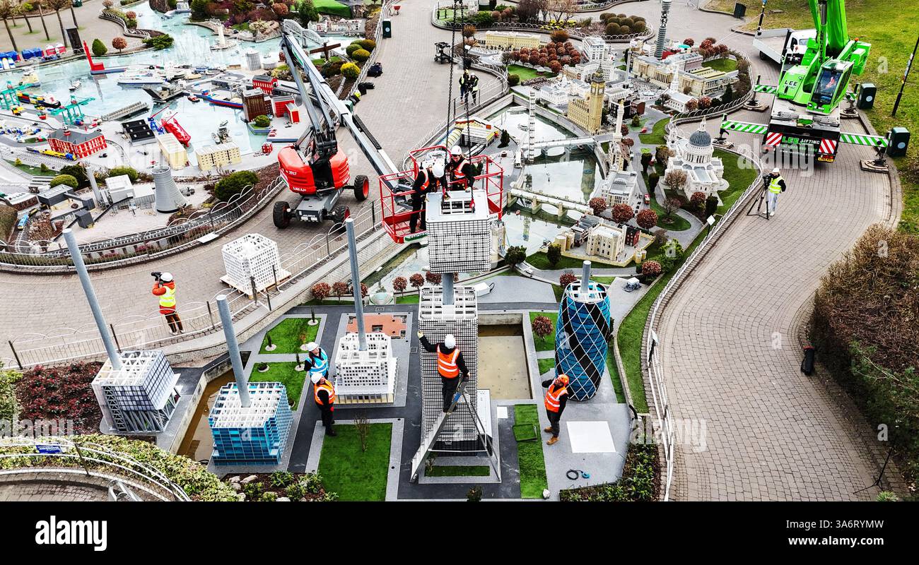 Model makers assemble a replica of One Canada Square as part of their ...