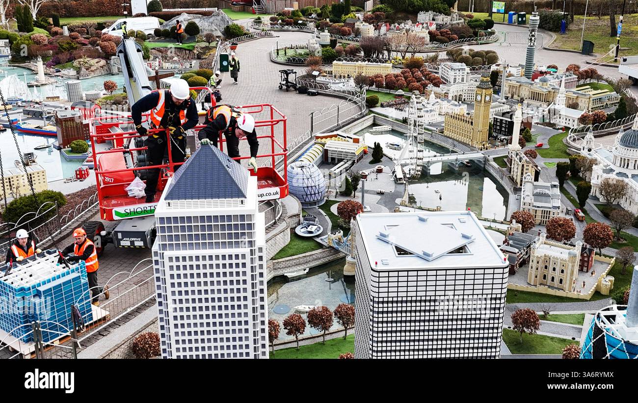 Model makers assemble a replica of One Canada Square as part of their ...