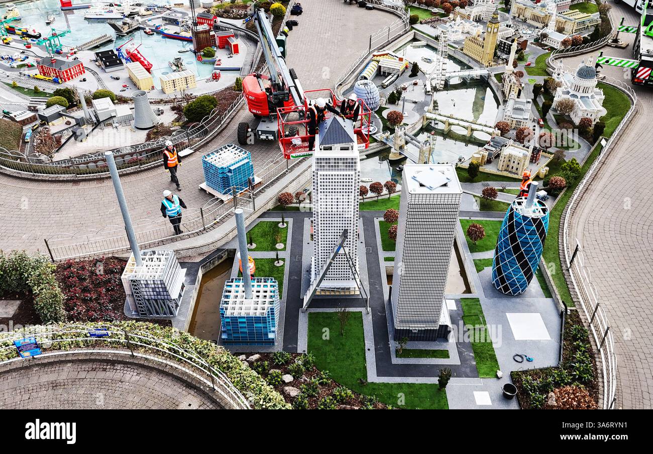 Model makers assemble a replica of One Canada Square as part of their ...
